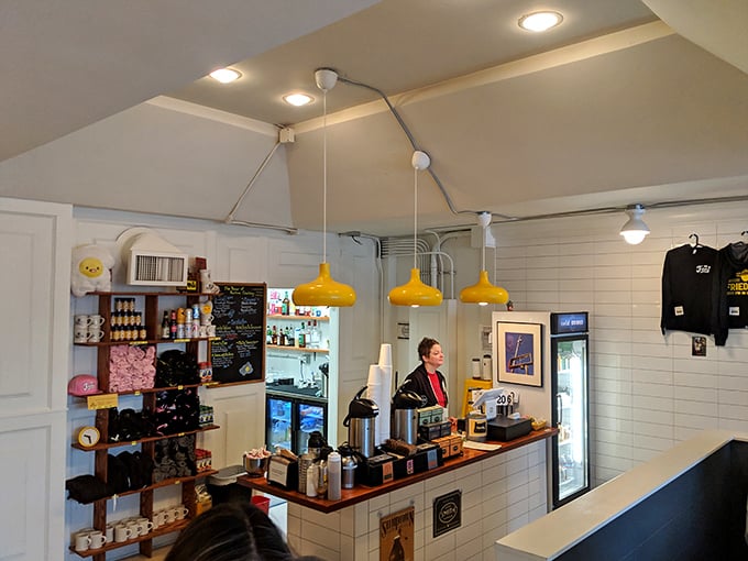 Behind this counter, breakfast artists craft their masterpieces. The yellow pendant lights spotlight the main stage of morning magic.