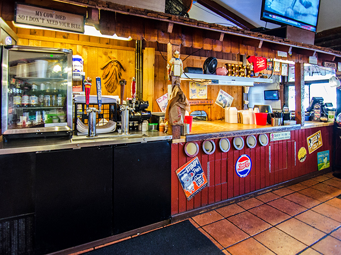 The counter where barbecue dreams come true. Notice the sign: "My cow died so I don't need your bull"—Florida honesty at its finest.