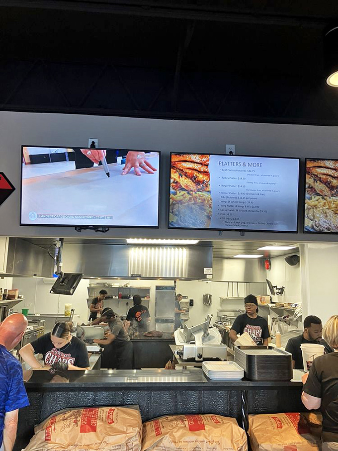 Behind the counter, the choreography of slicing, assembling, and serving happens with the precision of a well-rehearsed meat ballet.