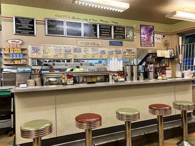 Classic chrome counter stools await the regulars who've been claiming the same spots for their morning coffee ritual for decades.