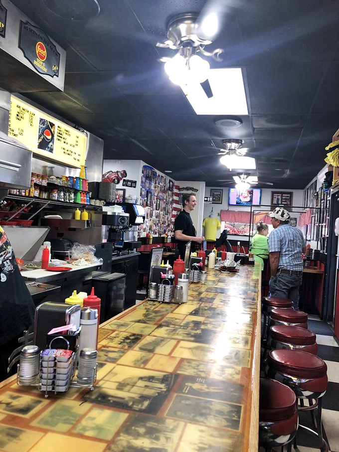The counter seats offer front-row tickets to the best show in town&mdash;watching masters craft the simple burger into something transcendent before your eyes.