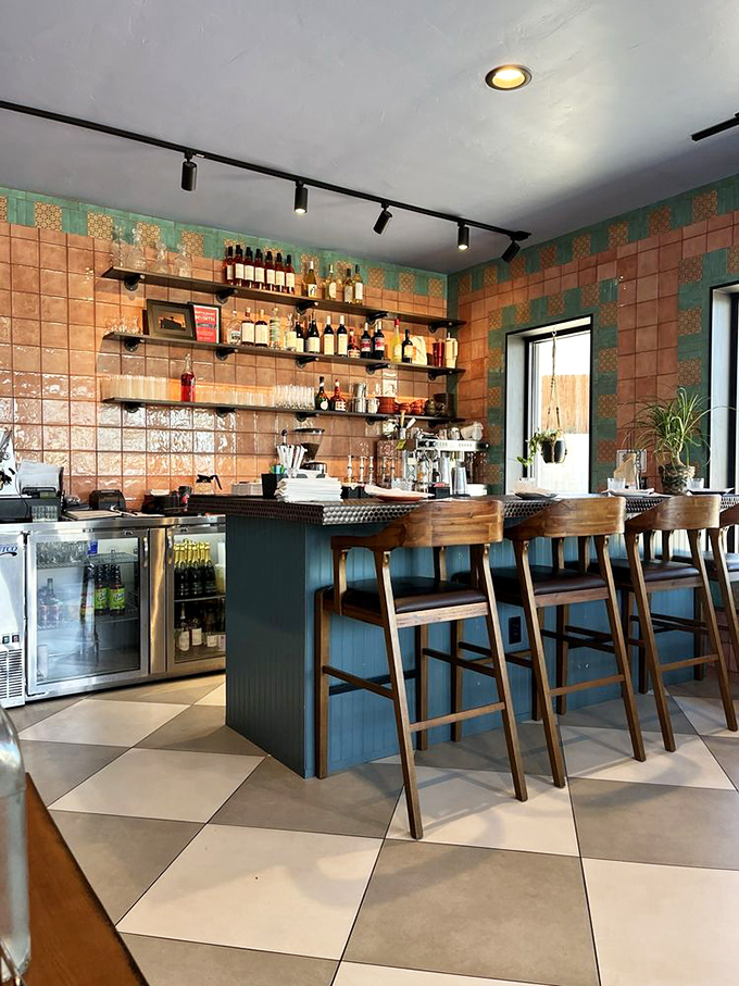 The bar seating offers front-row tickets to the breakfast show, with terracotta tiles creating a backdrop worthy of your morning caffeine ritual.