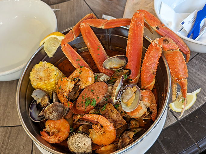 The seafood boil that stops conversation. Crab legs reaching skyward like they're trying to escape their delicious fate.