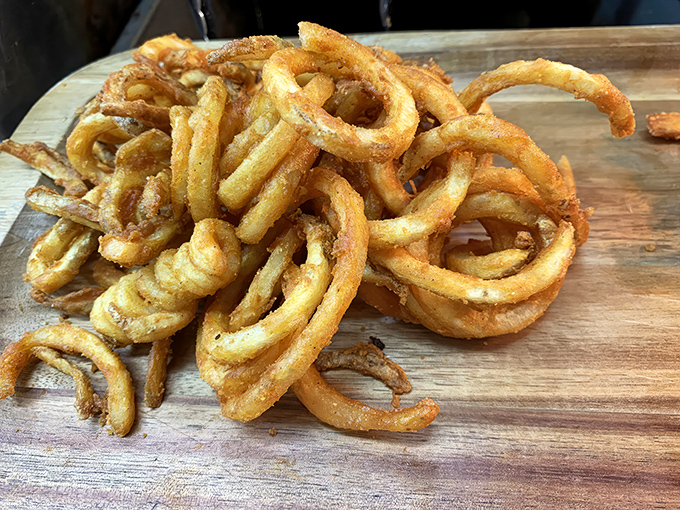 Curly fries that dance across your plate and straight into your heart. Seasoned, spiraled, and impossible to share.
