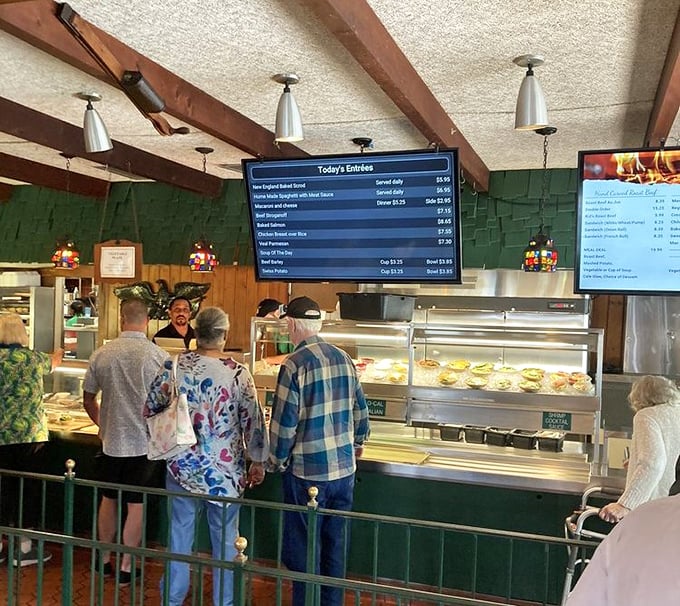 The food line at Beefcarver&mdash;where patience is rewarded with perfect portions and the gentle thrill of watching your meal come together before your eyes.