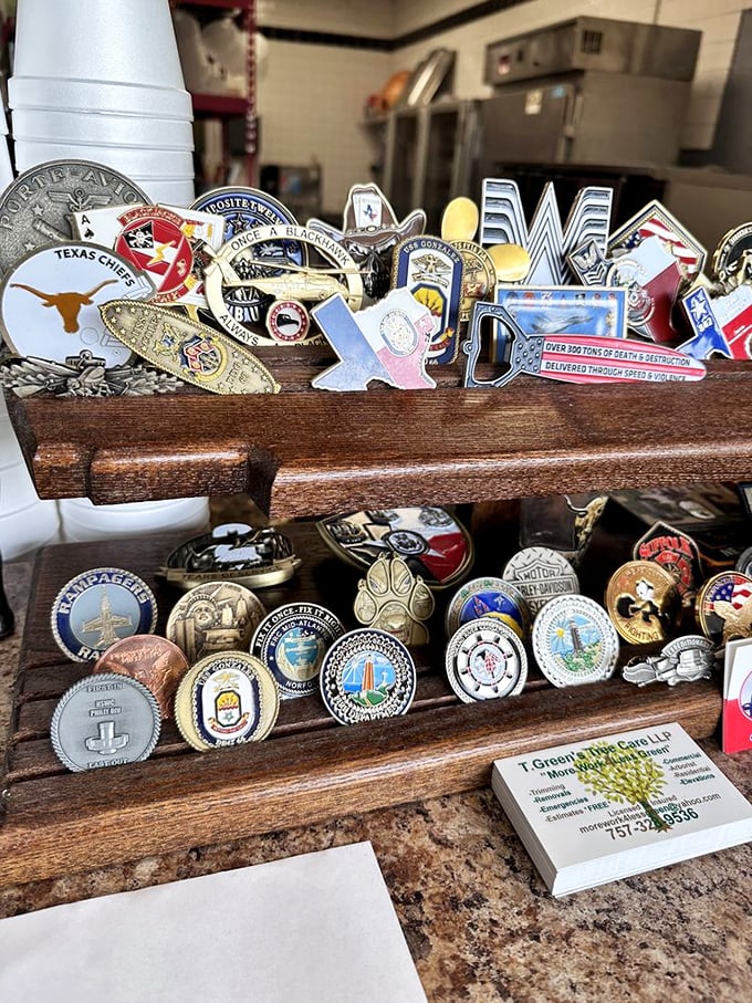 A collection of challenge coins and Texas memorabilia&mdash;the barbecue equivalent of Olympic medals. Each one tells a story of smoked meat excellence.