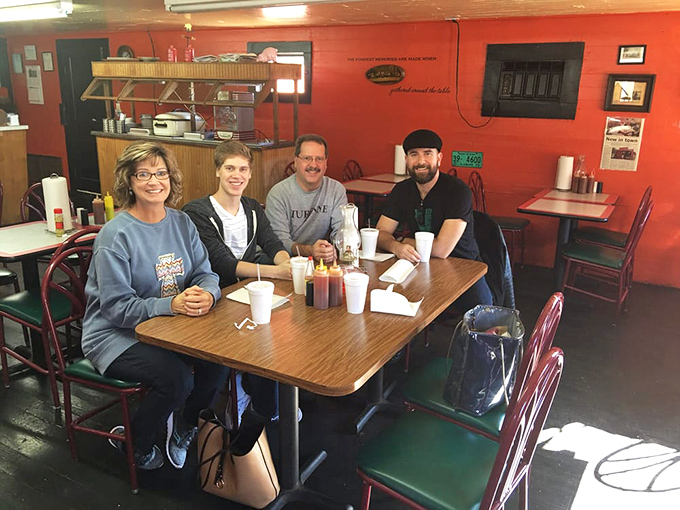 Every great barbecue spot has tables of people experiencing meat-induced happiness. These folks have discovered the secret Scottsboro handshake.