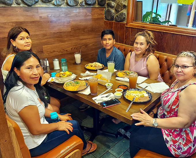 The true measure of a great restaurant: tables filled with happy diners sharing food, conversation, and the universal language of "mmm" with every bite.