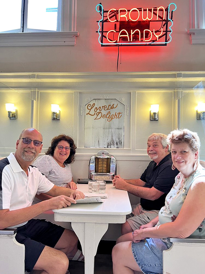 The neon sign above happy diners tells the real story&mdash;some places become institutions not because they change, but because they steadfastly refuse to.