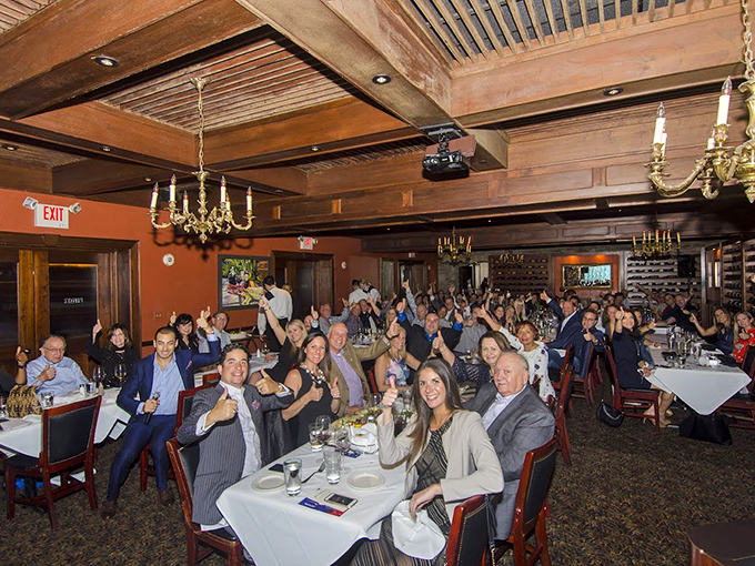 Happy faces and raised glasses. Nothing brings people together like the shared anticipation of expertly prepared animal protein.