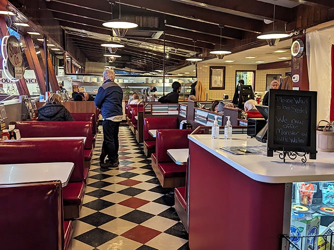 The diner's heartbeat: checkered floors, red booths, and the gentle hum of conversation that's been the soundtrack to Delaware meals since Eisenhower was president.