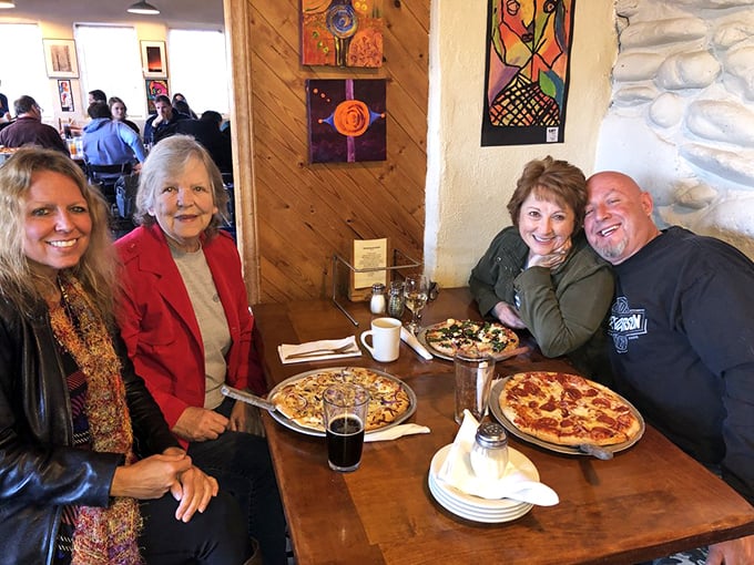 Generations gather around tables where memories are made, one slice at a time. Good pizza brings good people together.