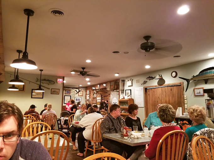The dining room hums with conversation and clinking glasses, where locals and visitors alike gather for seafood and stories.