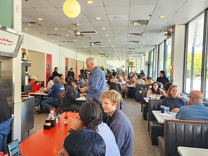 A full house at lunchtime&mdash;where strangers become neighbors and everyone's united by the universal language of "pass the ketchup, please."
