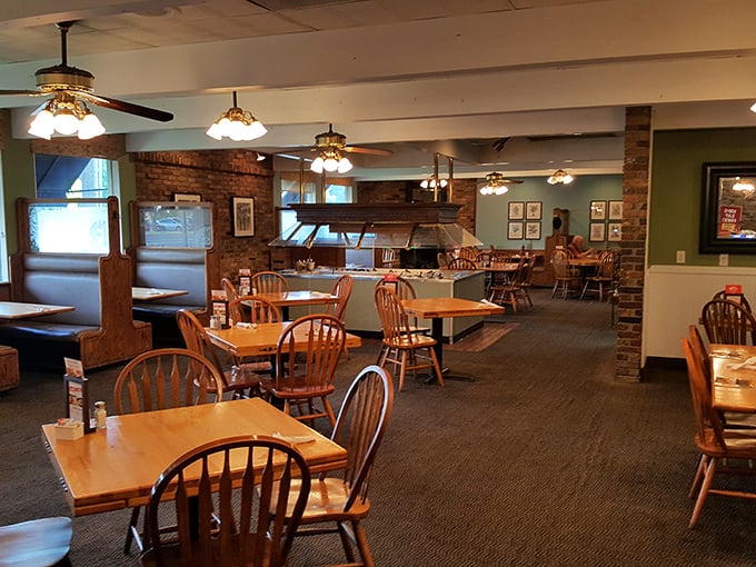 The dining room whispers, "Stay awhile," with its pendant lighting and wooden chairs that have supported generations of pie enthusiasts.