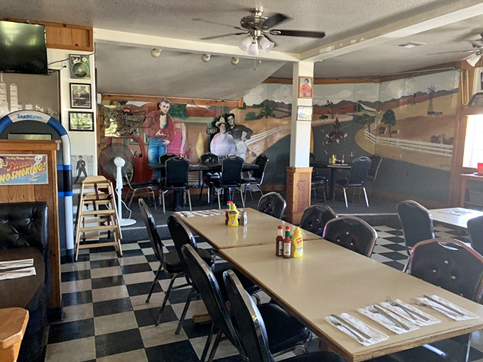 A mural of simpler times watches over diners as they feast. The checkered floor isn't just decoration&mdash;it's an invitation to step back in time.