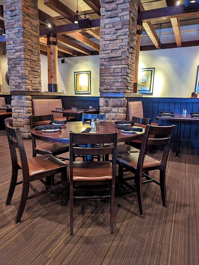 Stone columns and warm wood create the ultimate "let's linger over dinner" atmosphere. Like dining in a modern-day castle without the drafts.