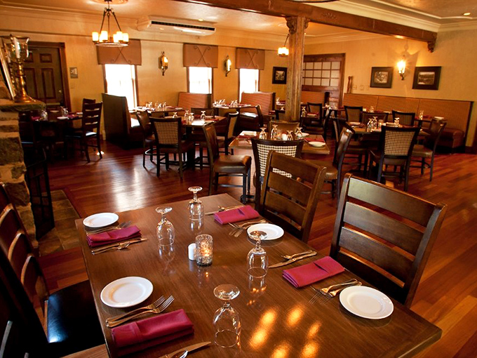 Elegant simplicity defines the dining room, where every table feels like the best seat in the house. Those windows frame the Poconos like living paintings.