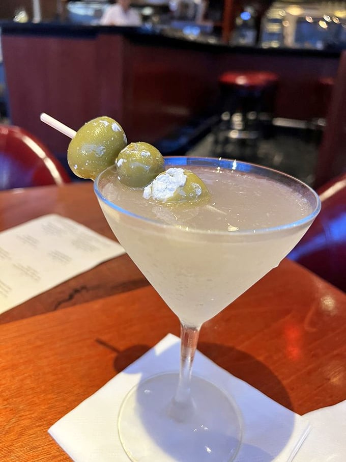 A dirty martini with blue cheese olives&mdash;civilization's answer to Monday meetings and traffic jams. Three olive salute to cocktail craftsmanship.