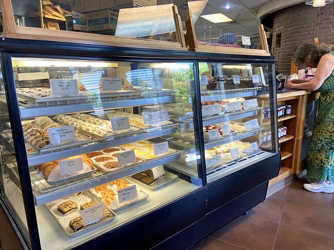 Sweet temptations that make diets futile. The display case is basically a museum of reasons to abandon all restraint.