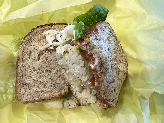 Crab sandwich architecture at its finest&mdash;structural integrity maintained despite generous filling. Engineering you can eat.