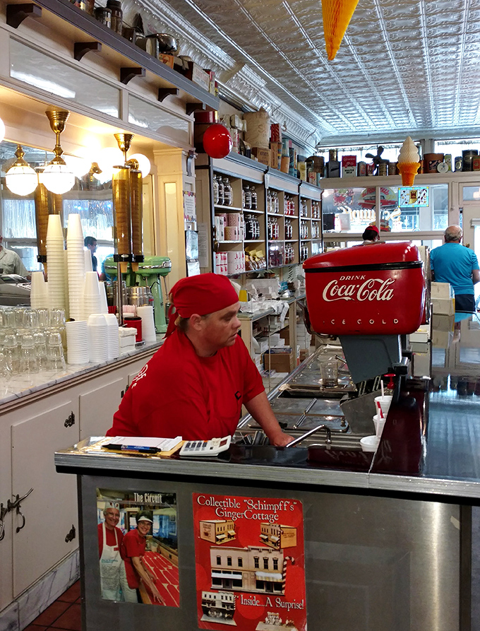 Behind every great candy counter is someone who knows the difference between merely sweet and truly transcendent. The red hat says it all.