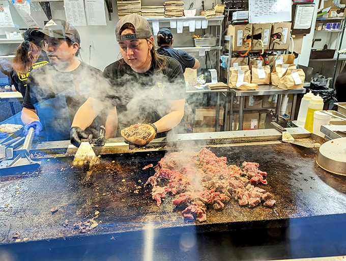 Behind every great cheesesteak is a team of dedicated grill masters, turning simple ingredients into edible art through steam and sizzle.