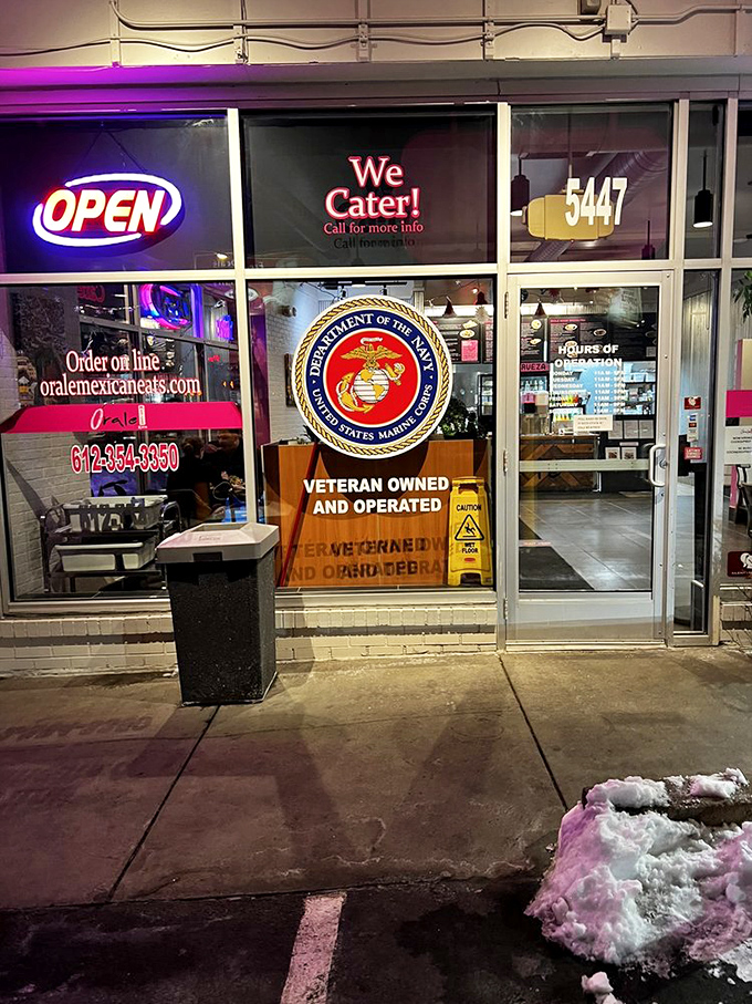 The Marine Corps emblem proudly displayed—this veteran-owned establishment serves food worth saluting, with hospitality that stands at attention.