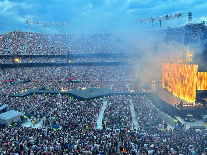 This appears to be a large concert or festival, not in Lucas. The crowd energy is palpable even through the photograph.