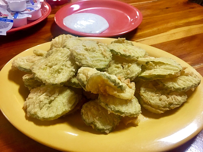 Fried pickles: the unofficial state appetizer of Arkansas. Crispy, tangy discs of joy that disappear faster than you can say "Pass the ranch."