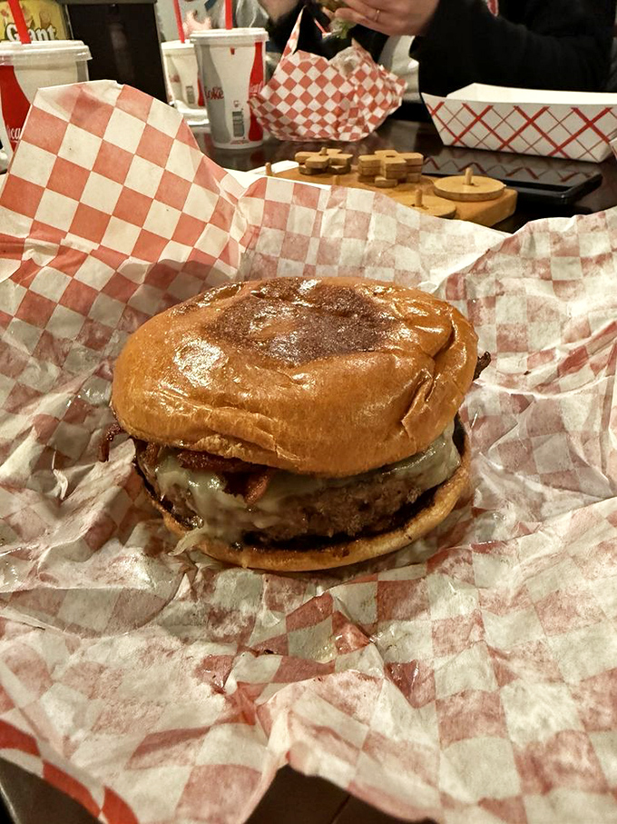 When your burger arrives wrapped like a present, you know you're in for something special. This isn't fast food—it's slow food served quickly.