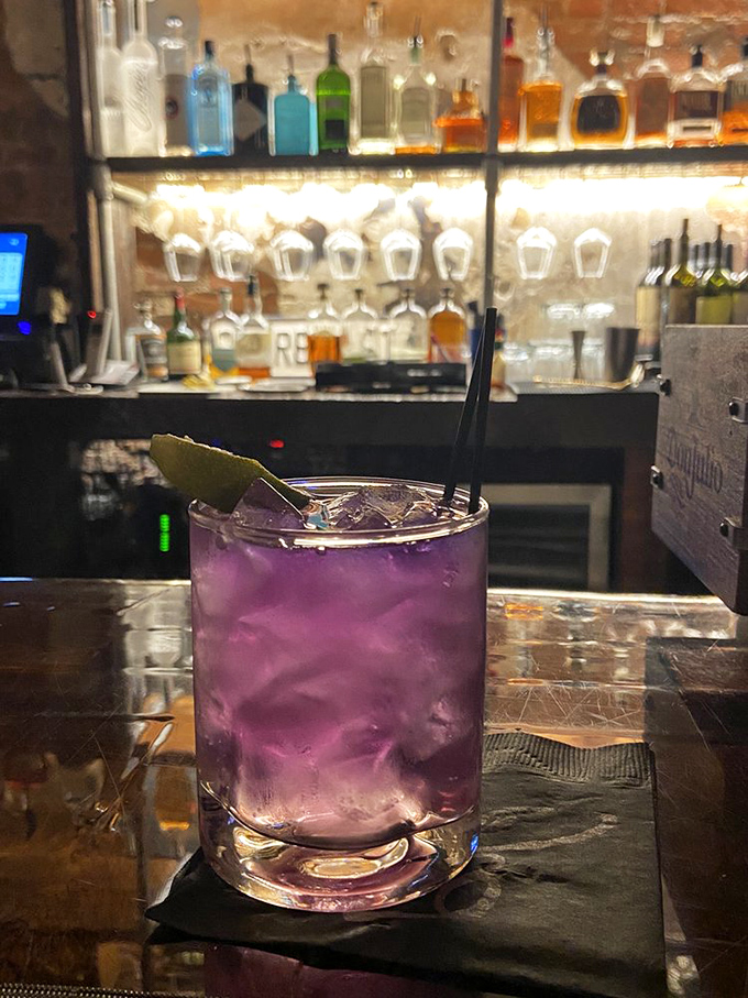This isn't just a purple cocktail; it's a conversation starter in a glass. Gin never looked so ready for its close-up.