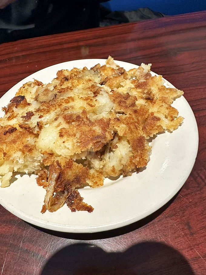Hash browns with the perfect crisp-to-tender ratio&mdash;the unsung heroes of breakfast who never ask for glory but always deliver satisfaction.