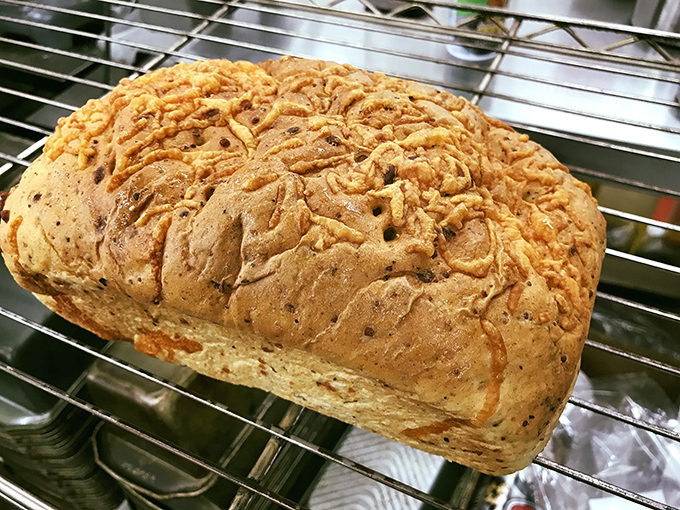 Herb cheese bread that looks like it's auditioning for a rustic food magazine &ndash; crusty, golden, and begging to be torn apart.