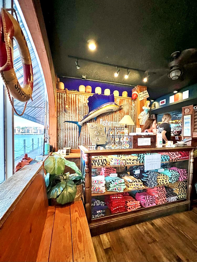 First impressions and last-minute souvenirs. The host station doubles as a merchandise area, because who doesn't want to take home a piece of the experience?