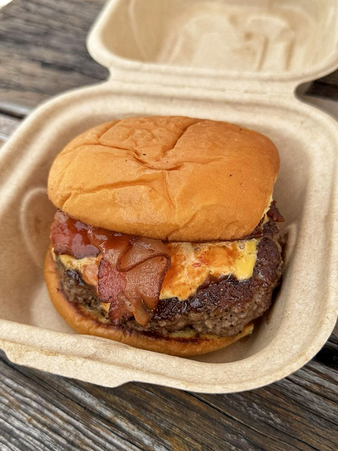 The Kenny J smiles up at you with bacon and cheese, practically whispering, "Your diet starts tomorrow."