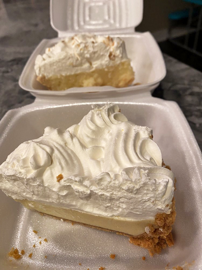 Two slices of pie in their natural habitat. The whipped cream peaks like the meringue Alps of my dreams.