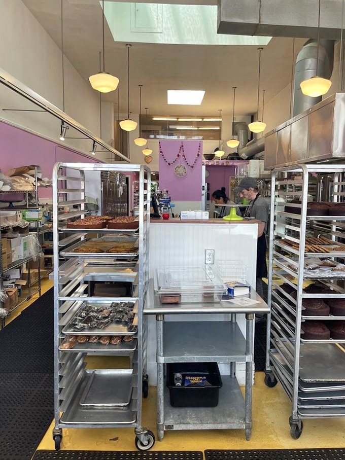 Behind the scenes magic happens here, where rolling racks and stainless steel tables transform simple ingredients into extraordinary creations.