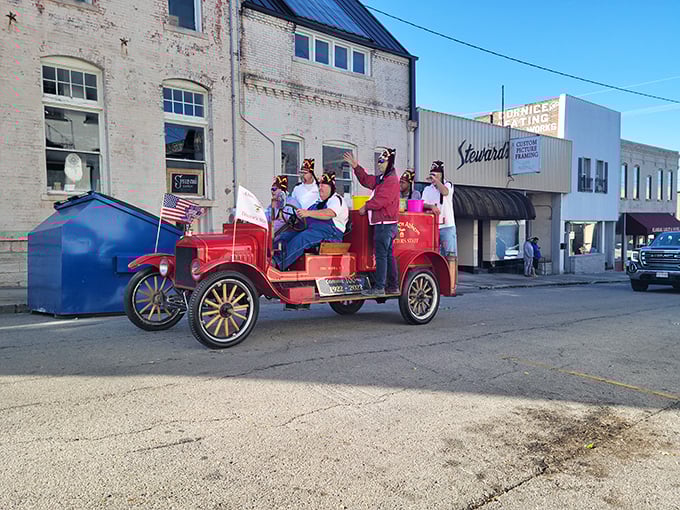 This vintage fire truck parade through downtown Carthage captures the town's love affair with its history and community celebrations.