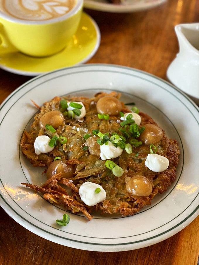 Latkes that could make your Jewish grandmother both jealous and proud, topped with dollops of tangy goodness.
