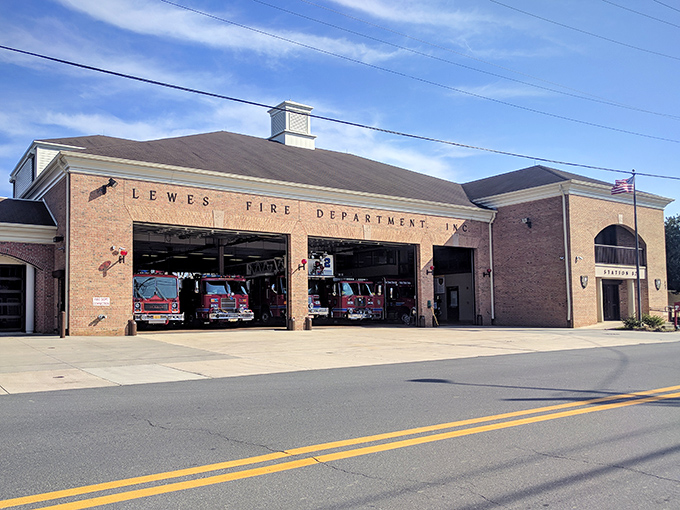 The Lewes Fire Department stands ready behind brick and glass, a modern facility housing the volunteer spirit that's protected this historic town since 1796.