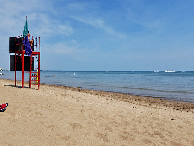 Lifeguard station standing sentinel over sandy shores. This red tower represents peace of mind for parents and the watchful eyes keeping Whihala Beach safe for all.