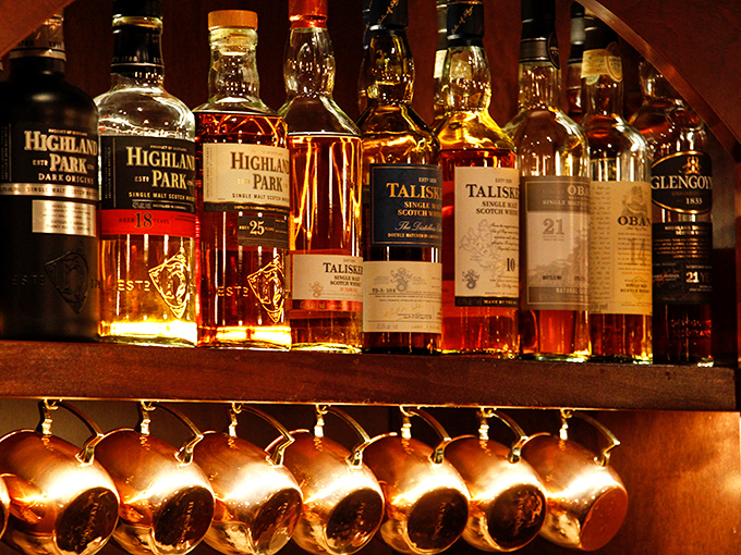 The bar's whiskey collection stands ready like an amber army. Those Highland Park and Talisker soldiers await your command to warm winter evenings.