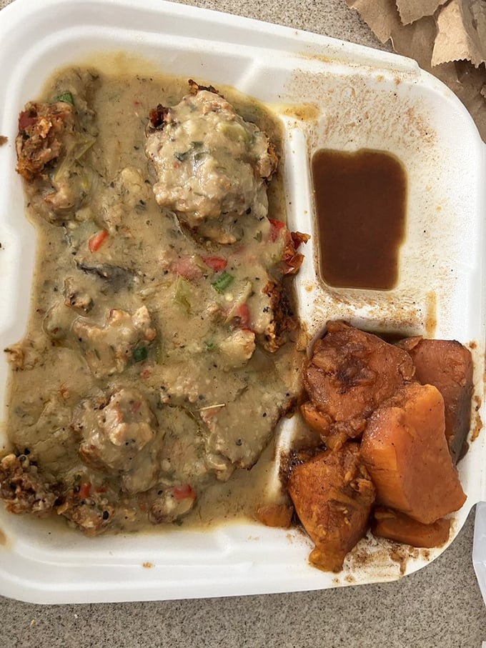 Meatloaf and yams sharing a container like old friends at a reunion &ndash; comfort food that feels like a warm hug from grandma.