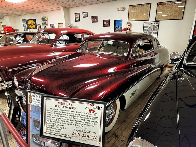 The 1950 Mercury "Lead Sled" gleams with post-war optimism and hot rod culture. Detroit metal transformed into street-legal sculpture.