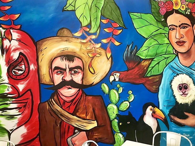 A wall that tells stories while you eat yours. Mexican cultural icons watch over your meal like benevolent culinary guardian angels.