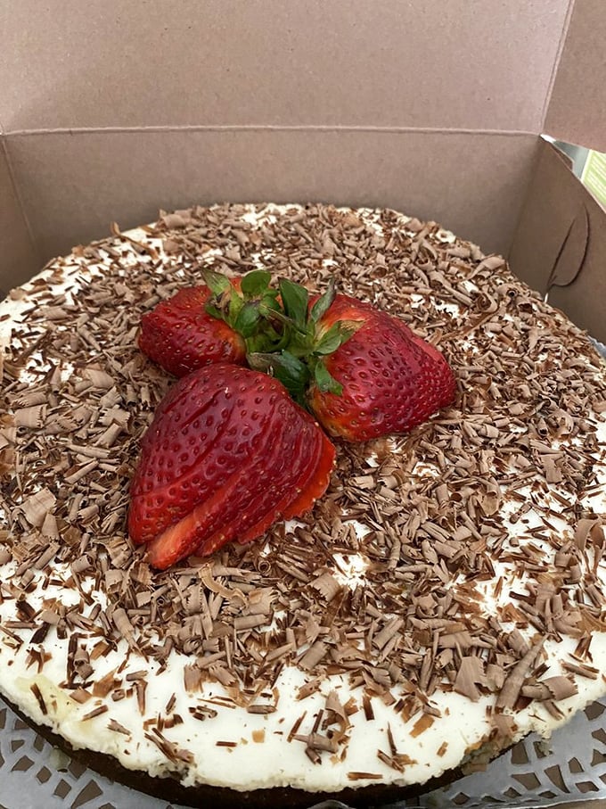 Strawberries and chocolate shavings aren't merely garnish &ndash; they're the jewelry that makes this cheesecake ready for its glamour shot.