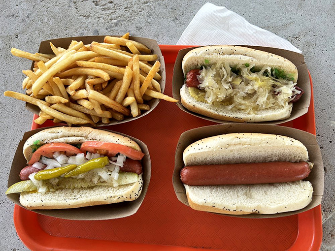 The New York dog lounges in its bun like it owns the place. That sauerkraut isn't just a topping&mdash;it's a statement of purpose.