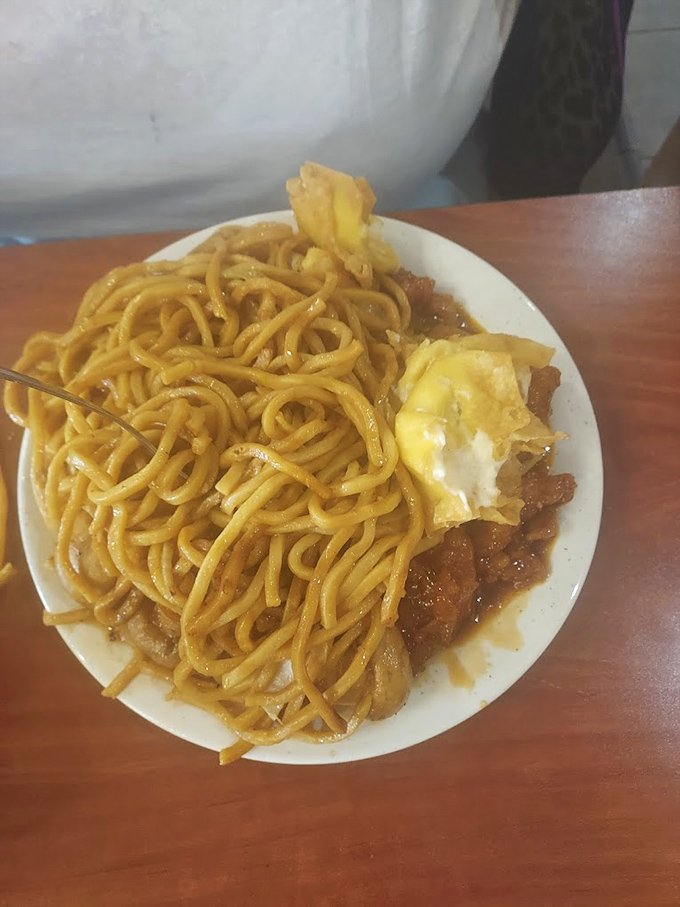 A mountain of lo mein noodles that would make Marco Polo weep with joy&mdash;tangled with savory treasures in every forkful.