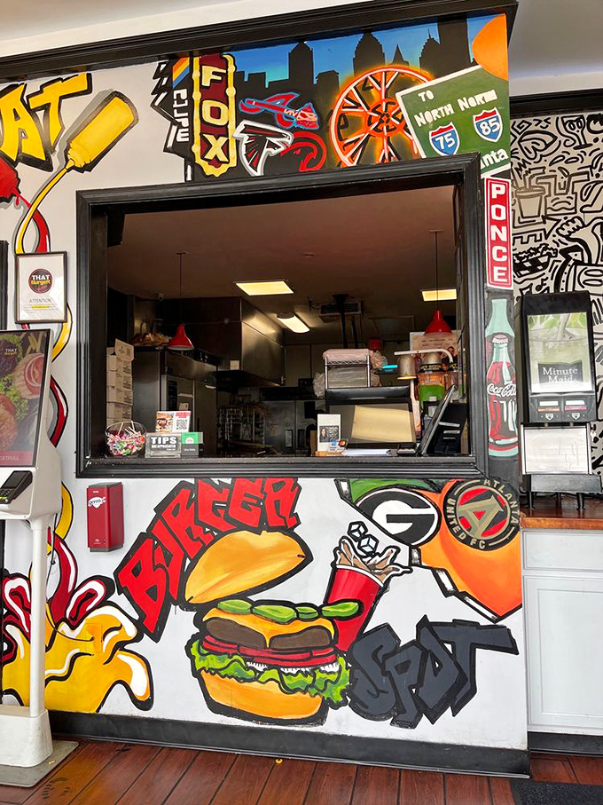 The vibrant murals aren't just decoration&mdash;they're a declaration of Georgia pride. This burger spot doesn't just feed you; it welcomes you home.